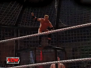 Test hits Rob Van Dam with a Diving Elbow Drop off the top of the ...